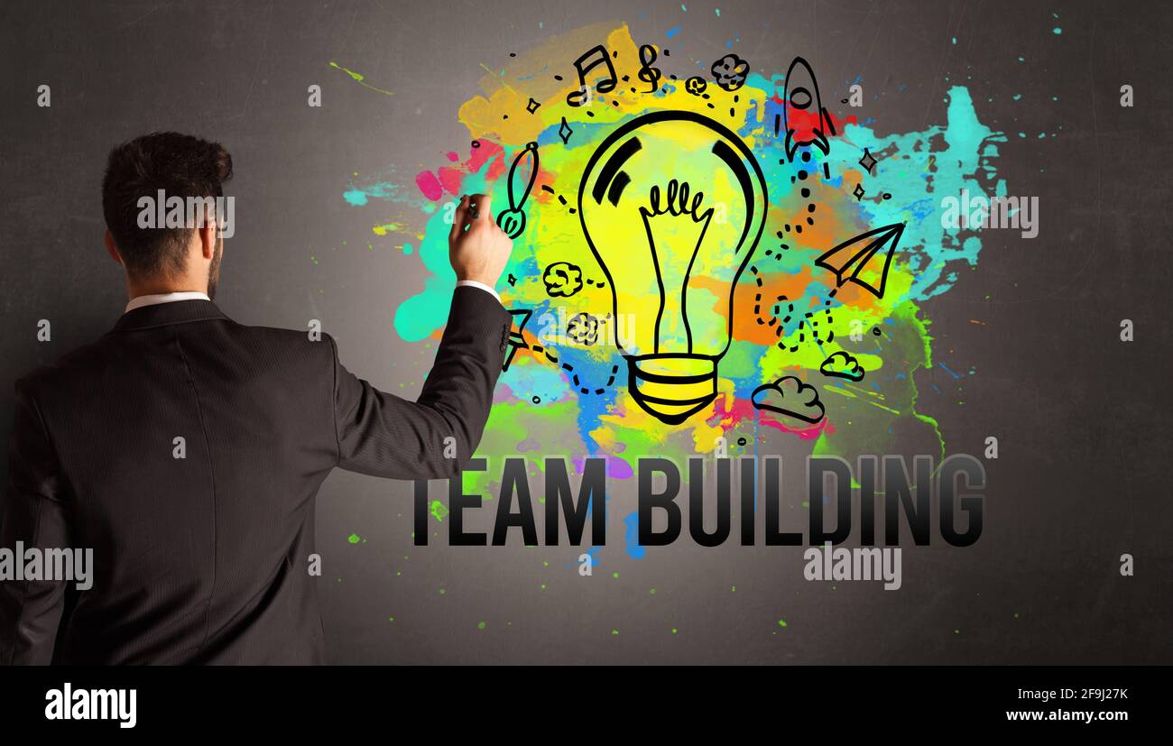 businessman drawing colorful light bulb Stock Photo - Alamy