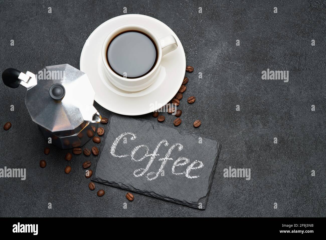 Coffee handwritten inscription sign on chalk board and cup of espresso ...