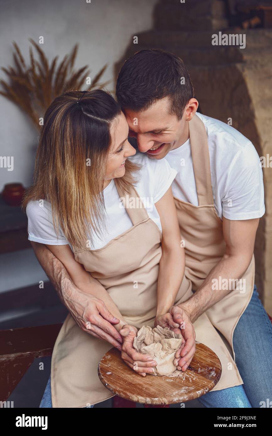 romantic couple in love working together on potter wheel and scu Stock ...