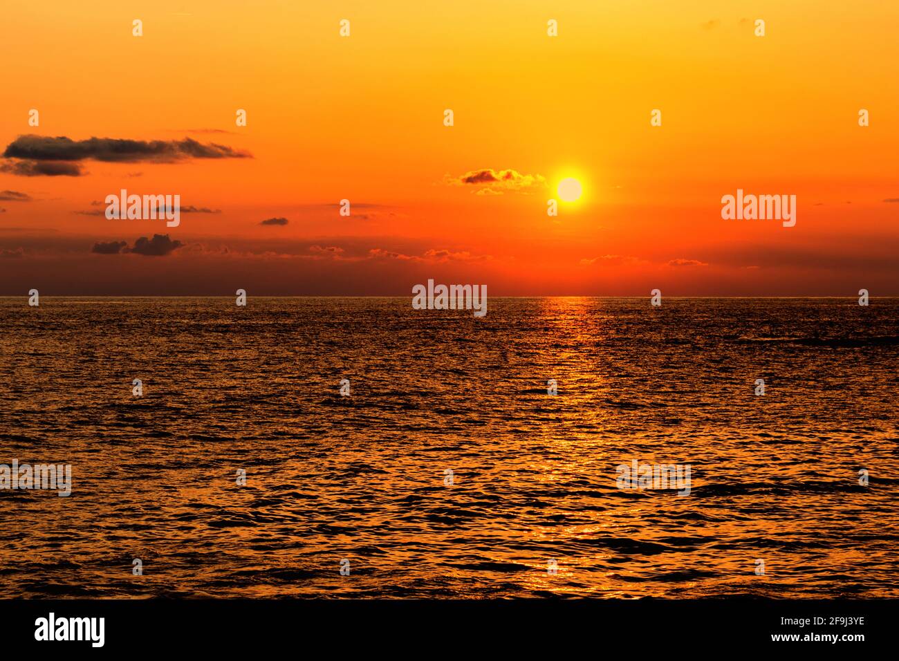 Sunset over ocean. Summer evening Stock Photo - Alamy