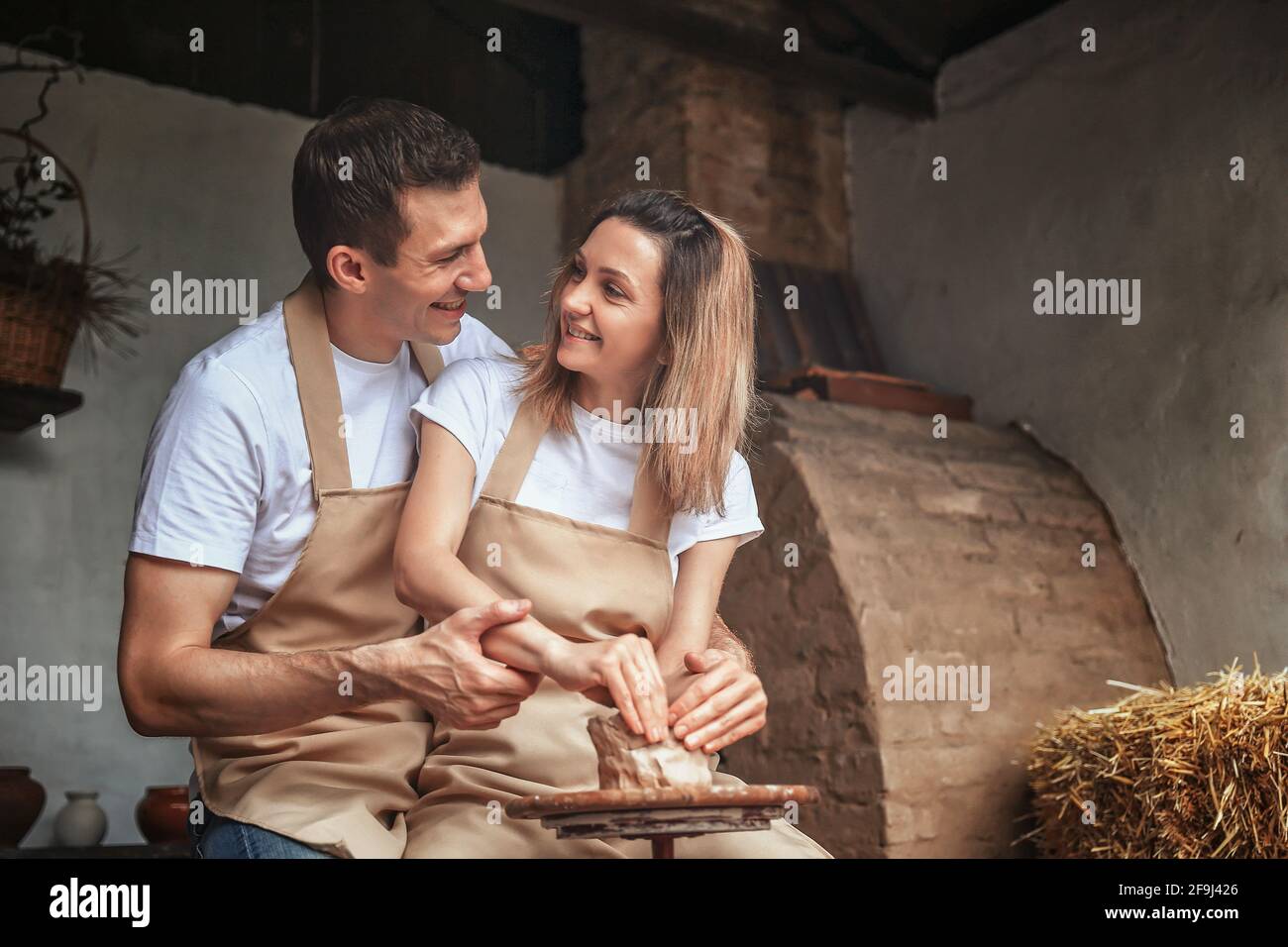 romantic couple in love working together on potter wheel and scu Stock ...