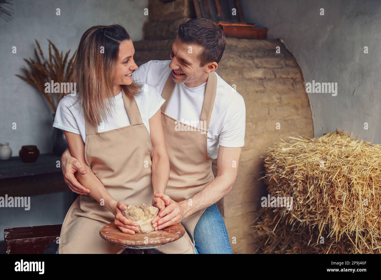 romantic couple in love working together on potter wheel and scu Stock ...