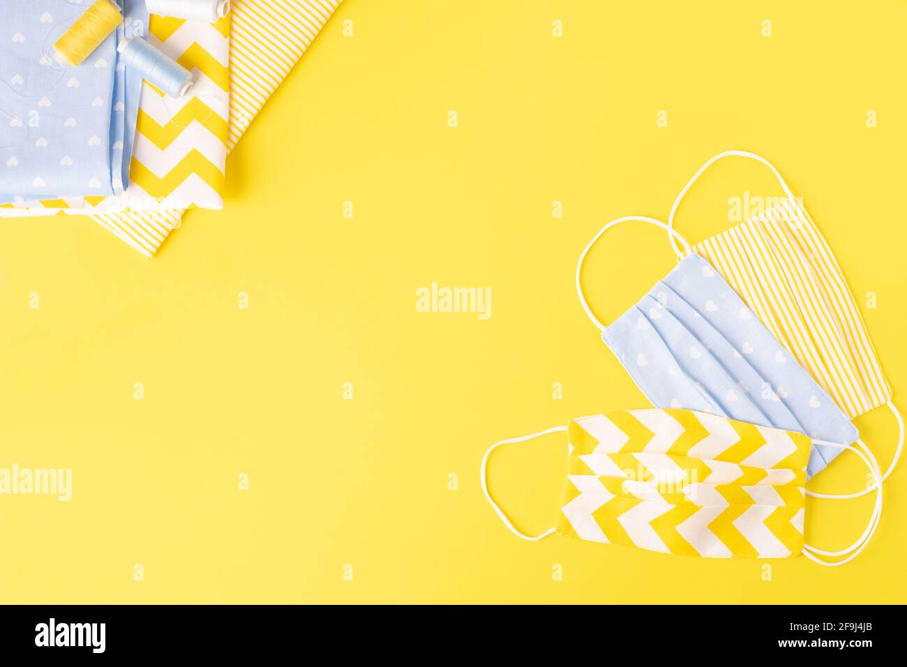 Eco-friendly reusable cloth face shield and sewing accessories on top ...