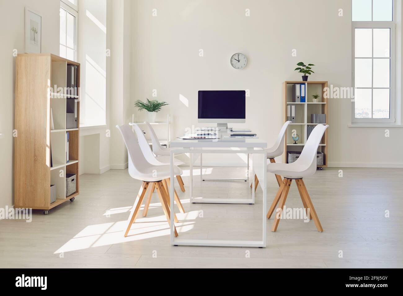 Interior of modern meeting room with big table, comfortable chairs and ...