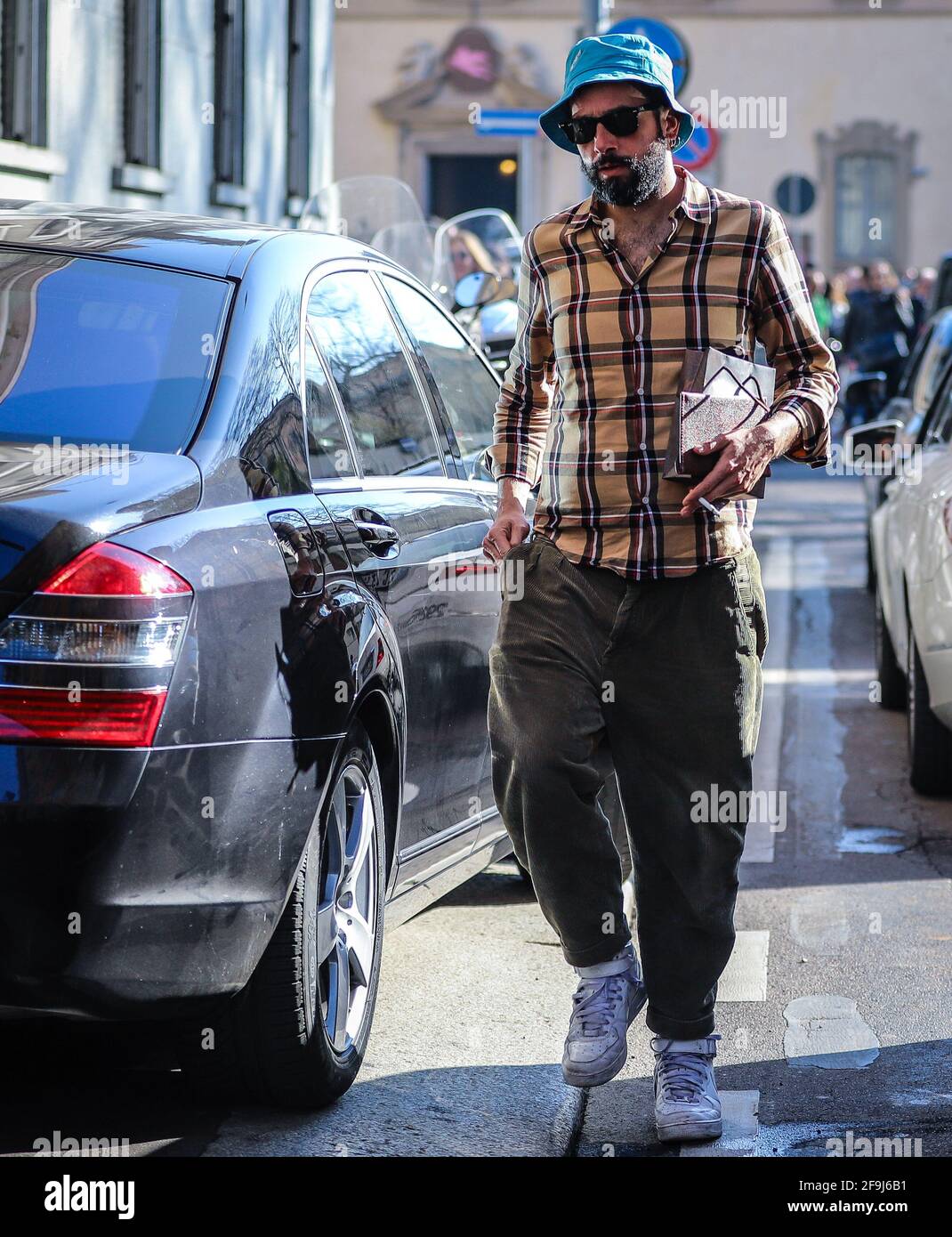 MILAN, Italy- February 22 2019: Men on the street during the Milan ...
