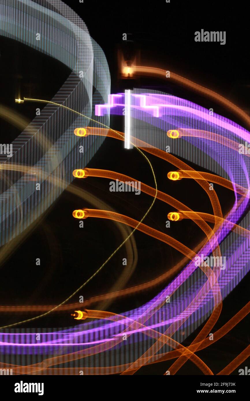 Long exposure light painting of neon lights Stock Photo - Alamy