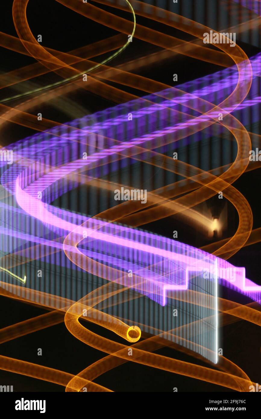 Long exposure light painting of neon lights Stock Photo - Alamy