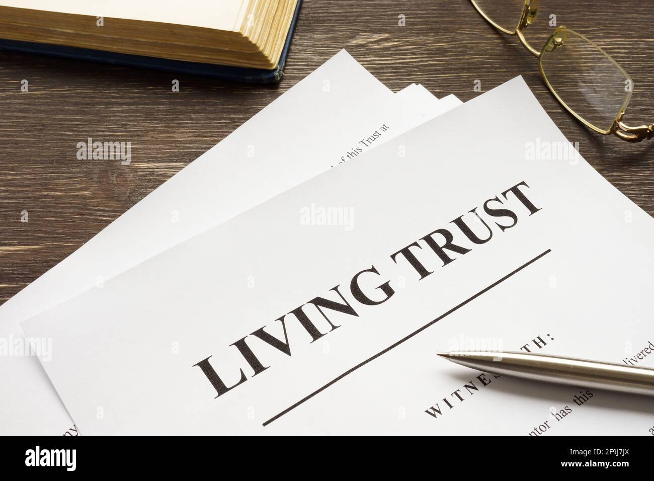 Living trust papers with pen and book Stock Photo - Alamy