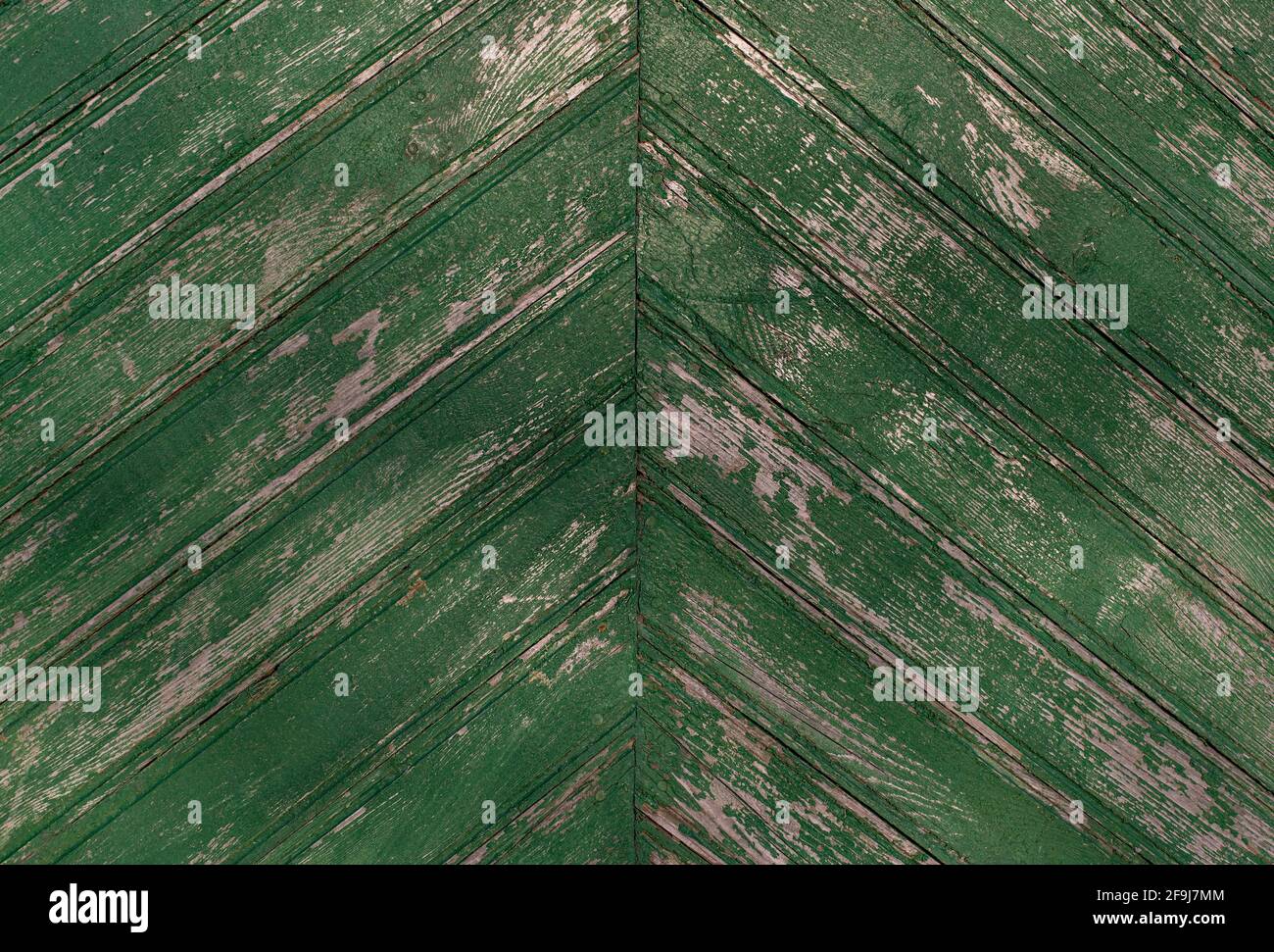old weathered wood texture painted green color. herringbone pattern ...