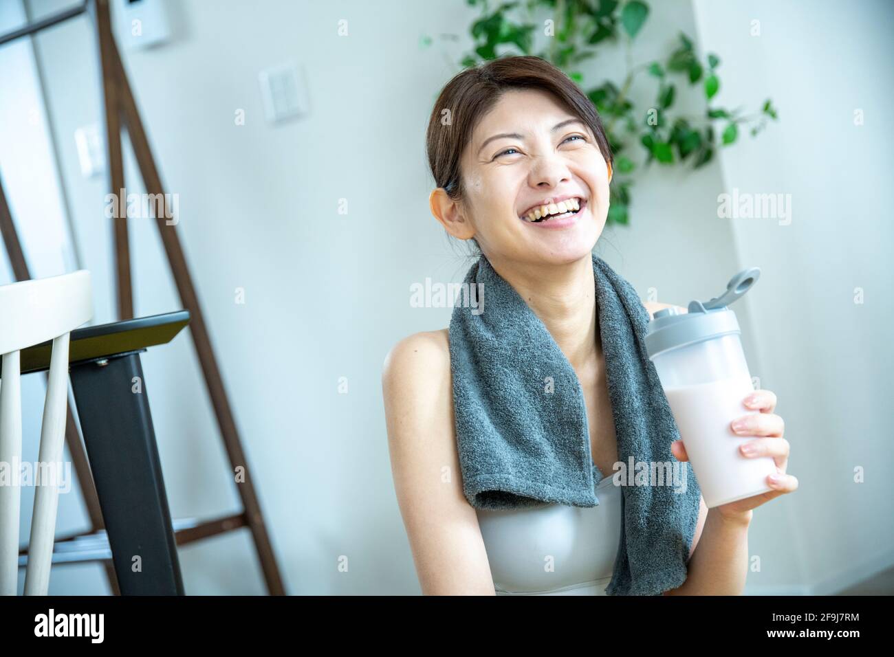 Woman Drinking Protein Drink Stock Photo - Alamy
