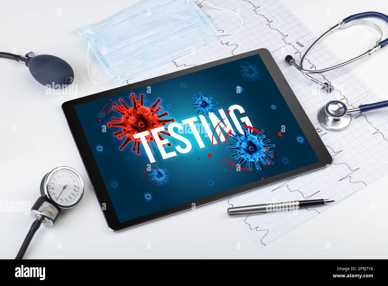 Tablet pc and doctor tools on white surface Stock Photo - Alamy
