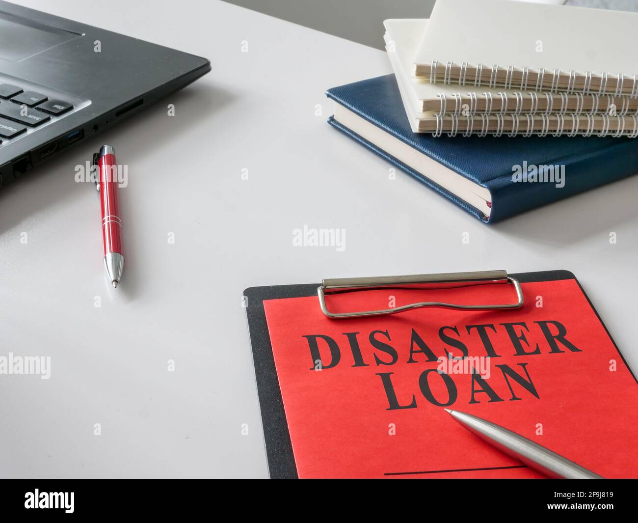 Disaster loan form for signing on the white desk Stock Photo - Alamy