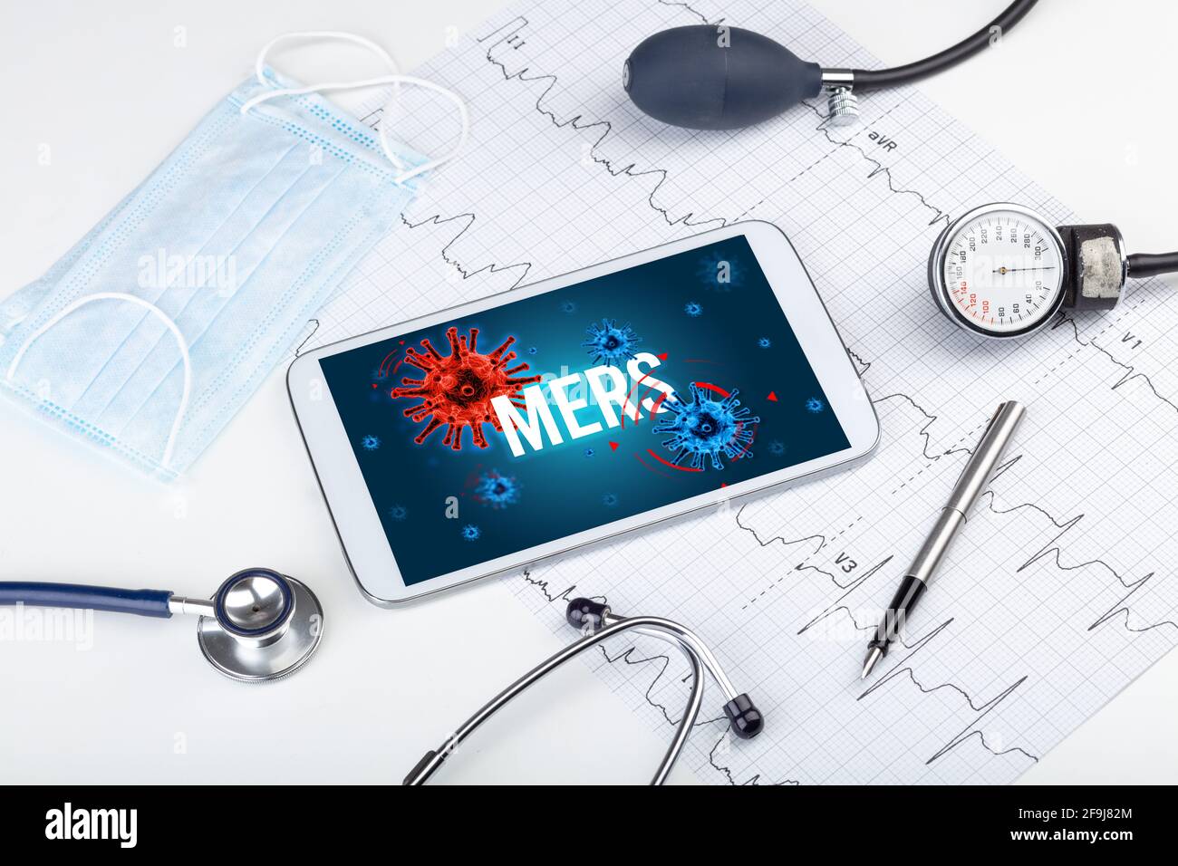 Tablet pc and doctor tools on white surface Stock Photo - Alamy