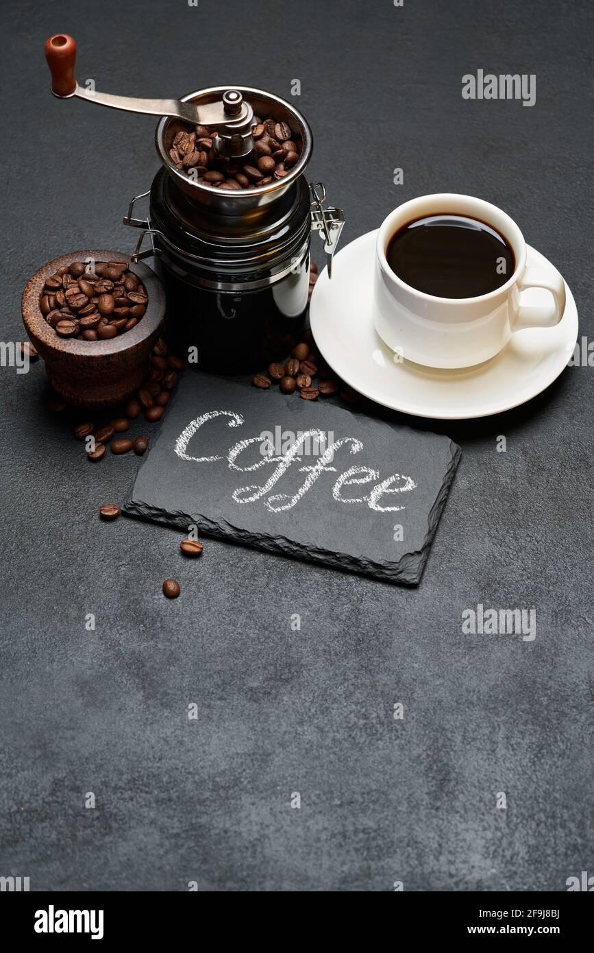 Coffee handwritten inscription sign on chalk board and cup of espresso ...