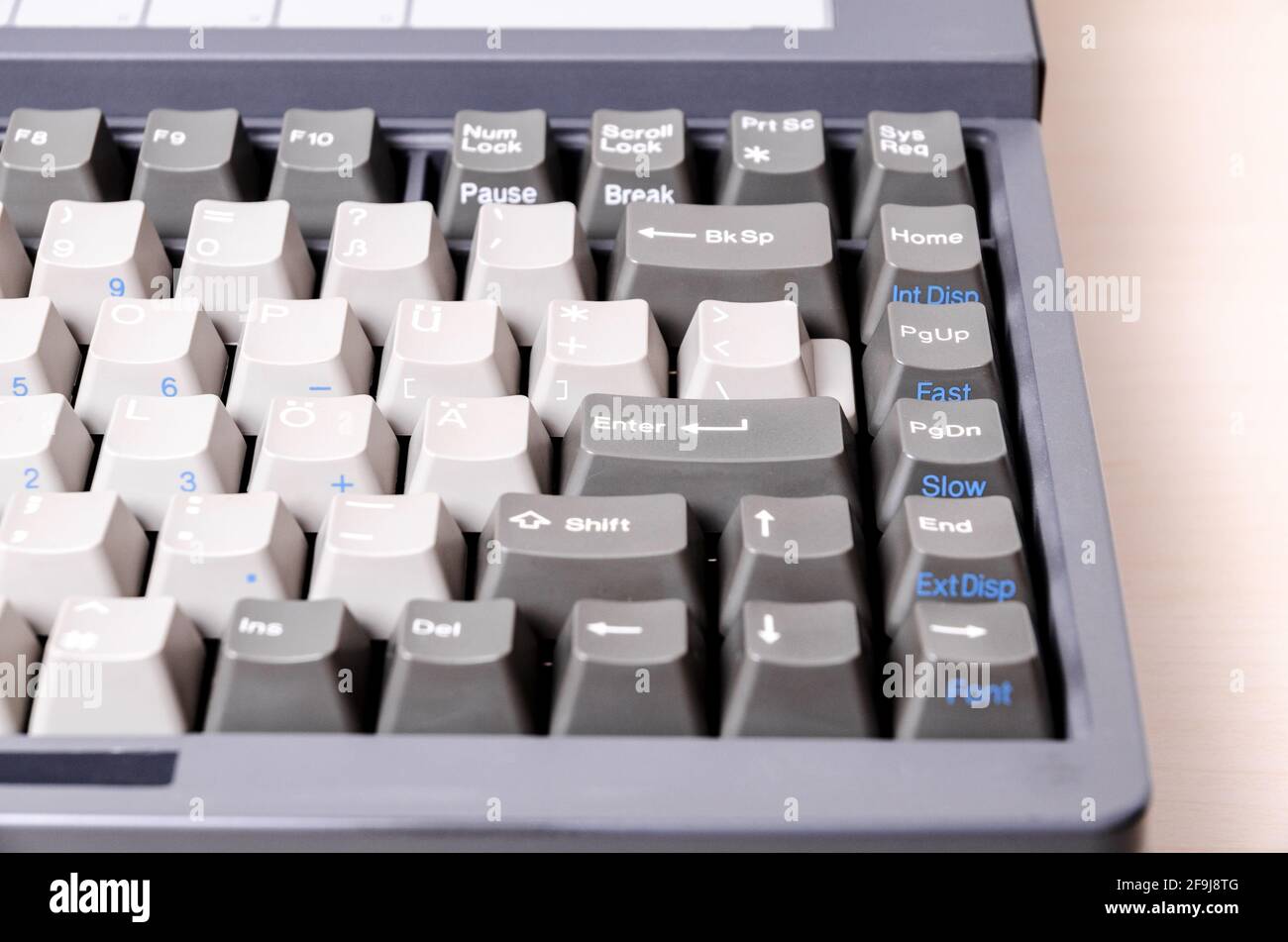 Keyboard with different grey buttons of an old fashioned Laptop, close ...