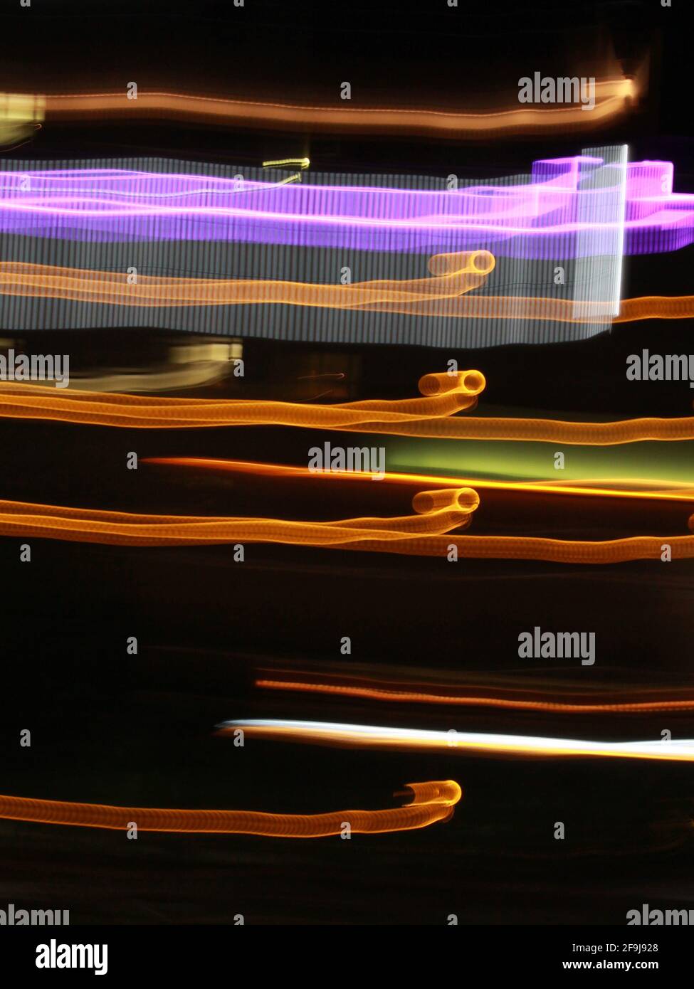 Long exposure light painting of neon lights Stock Photo - Alamy