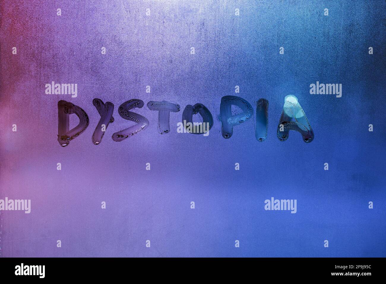 the word dystopia handwritten on wet window glass surface Stock Photo ...
