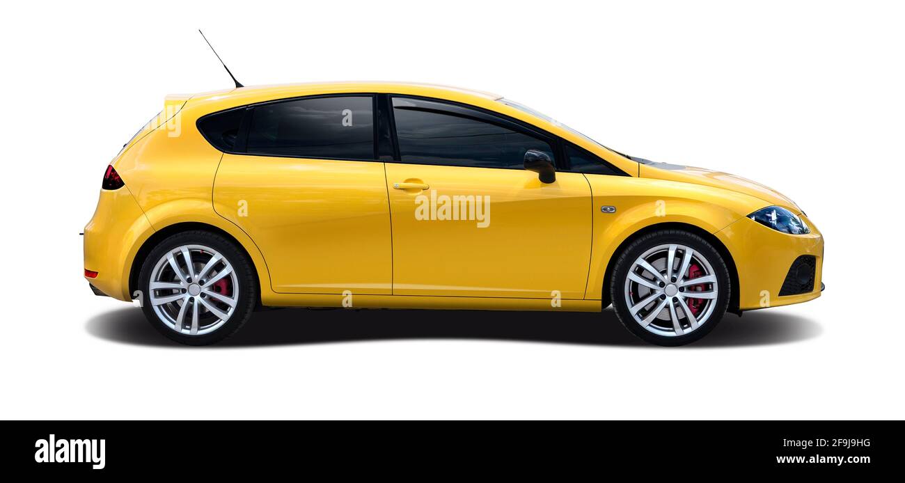 Yellow Seat Leon side view isolated on white background Stock Photo - Alamy