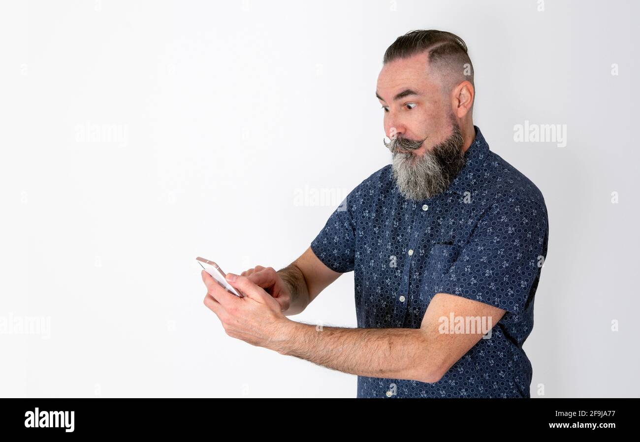 Hipster with Caucasian appearance, 40-45 years, making a surprised face ...