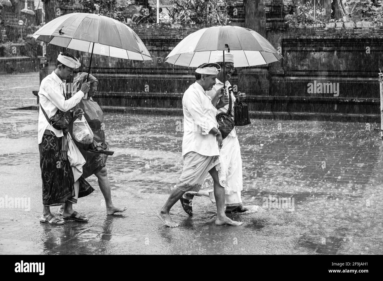 A Group Of Balinese Hindu People Leaving The Batara Turun Kabeh ...