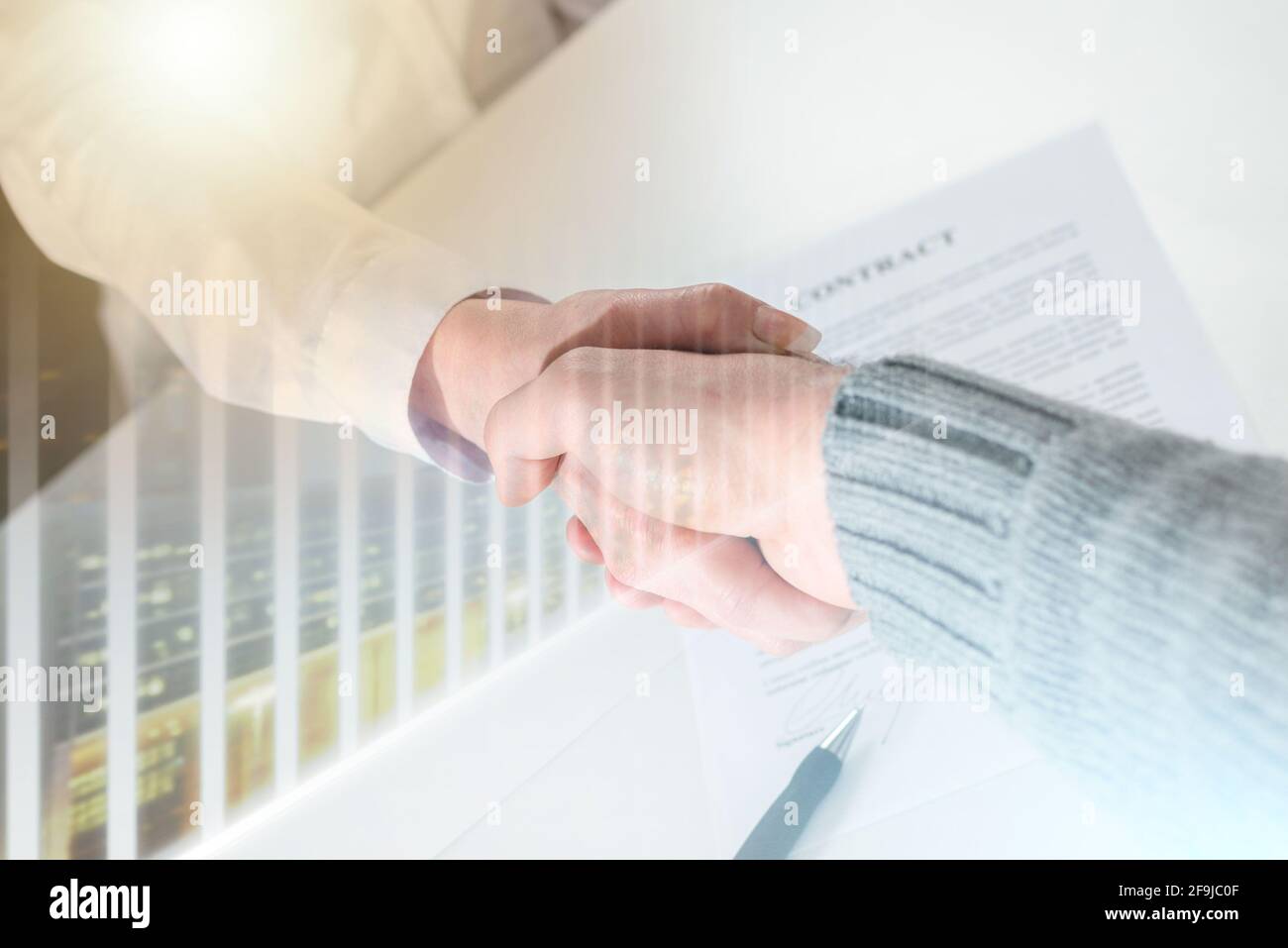 Handshake after contract signing; multiple exposure Stock Photo - Alamy