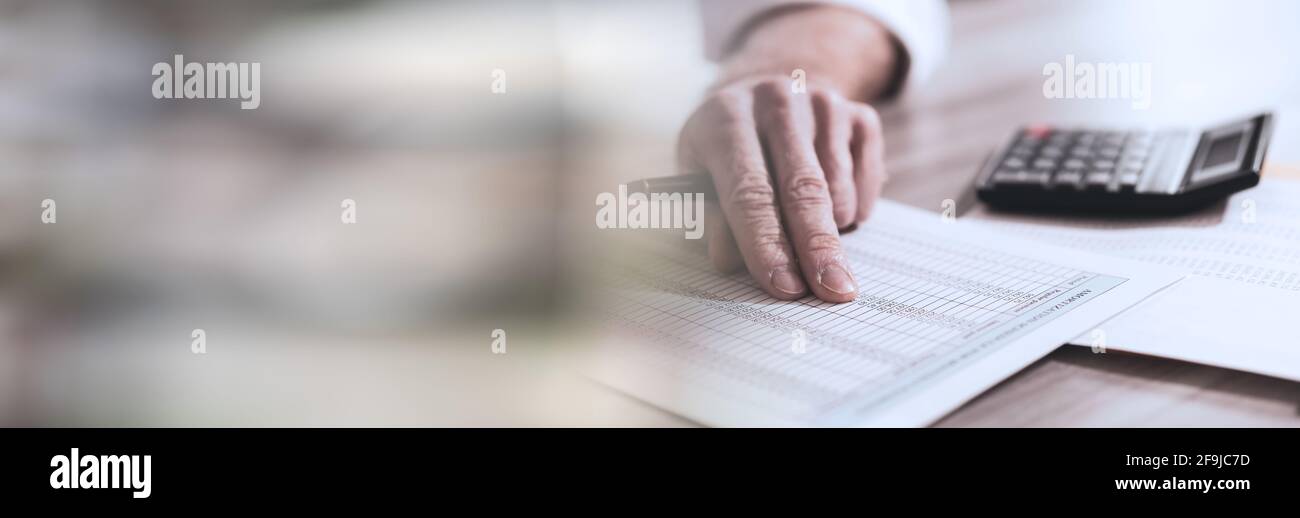 Hand of accountant checking financial document. panoramic banner Stock ...