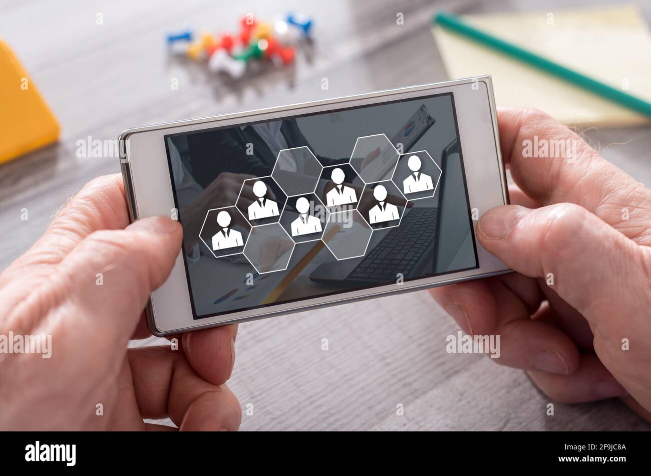 Team concept on mobile phone Stock Photo - Alamy