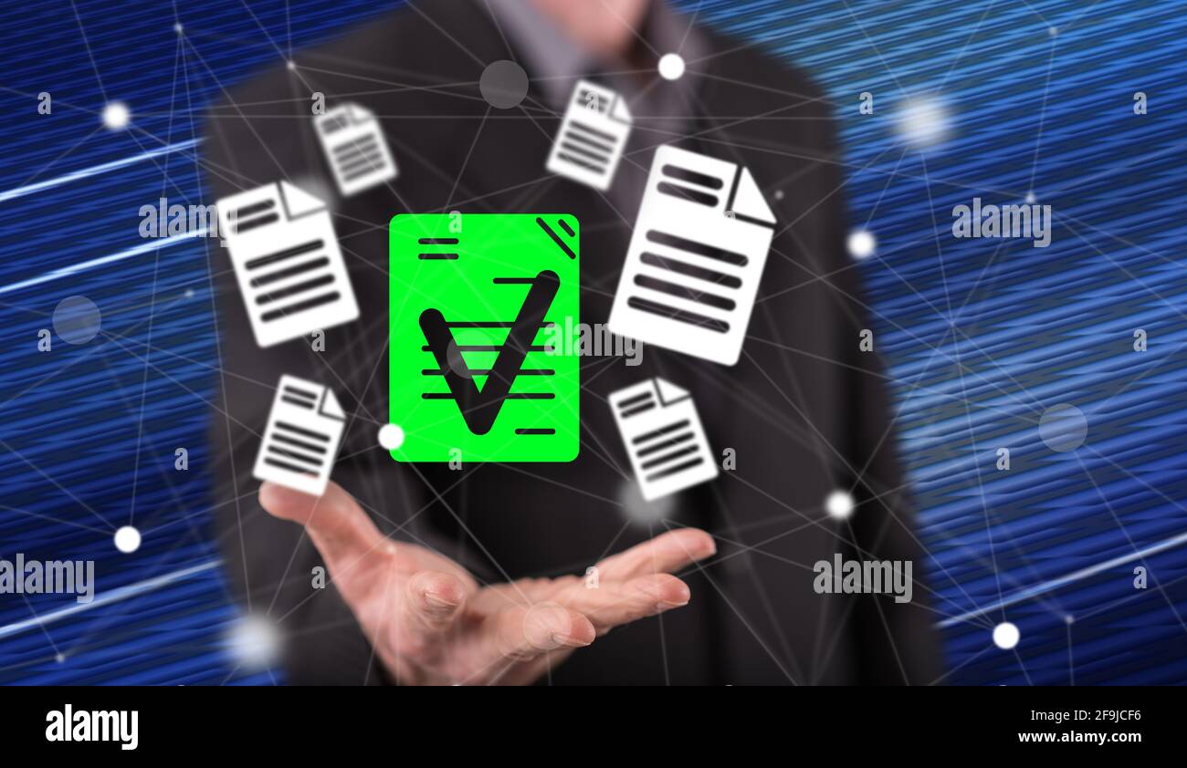Document validation concept above the hand of a man in background Stock ...