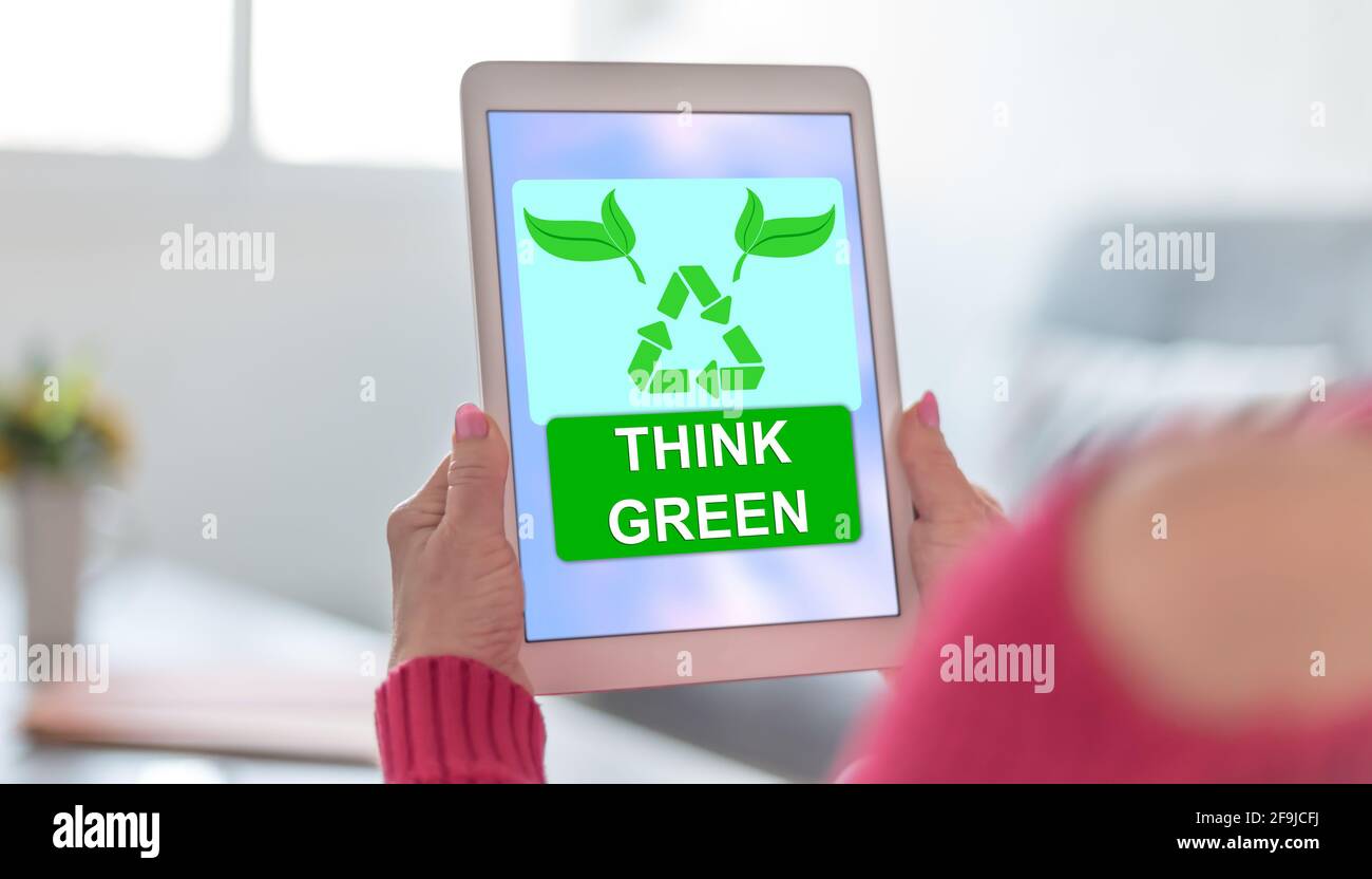 Tablet screen displaying a think green concept Stock Photo - Alamy