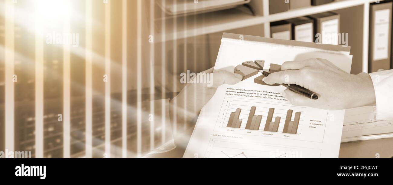 Two business people analyzing a chart; multiple exposure Stock Photo ...