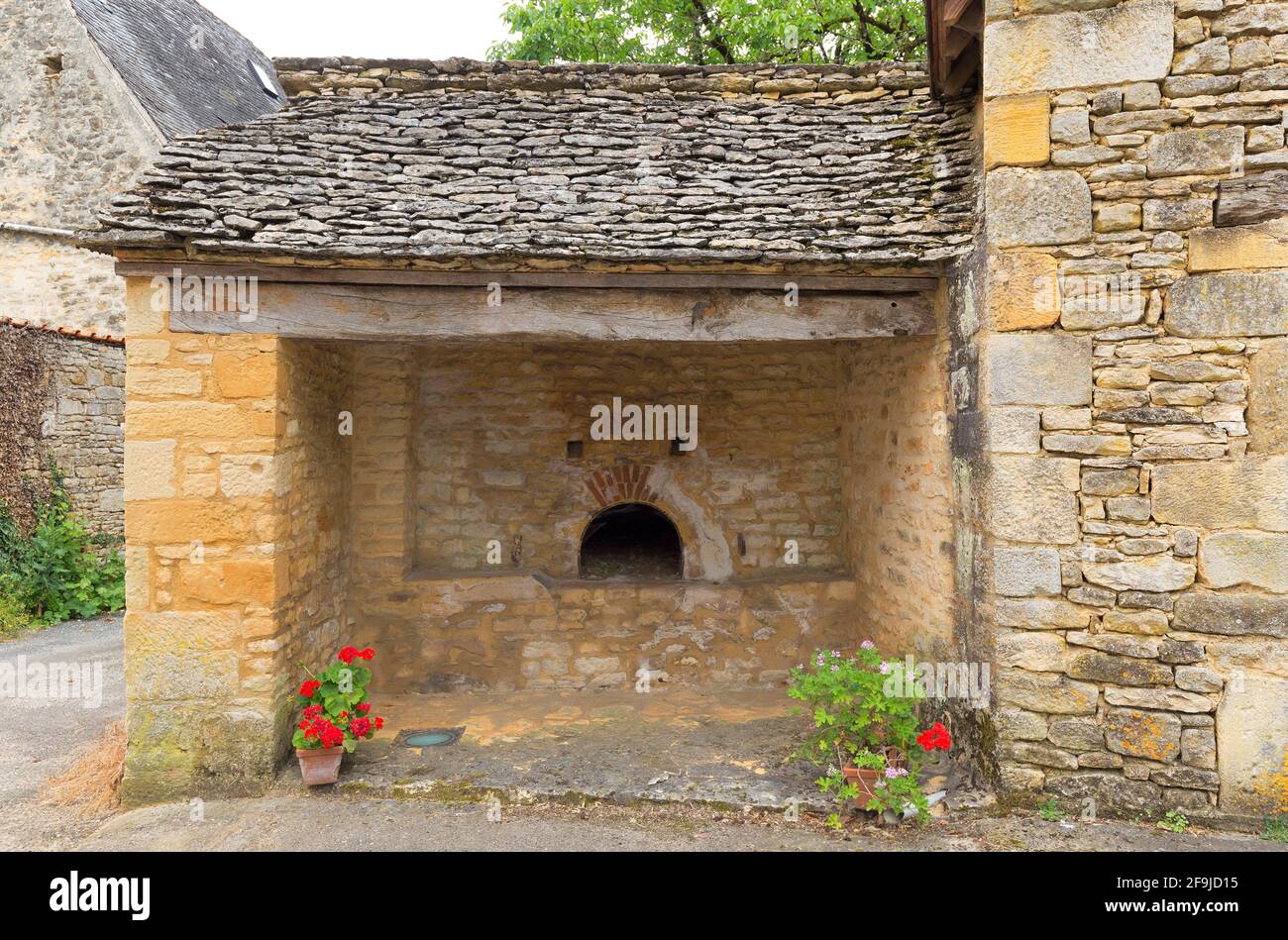 An aged communal bread oven in the pretty village of Archignac, in the ...