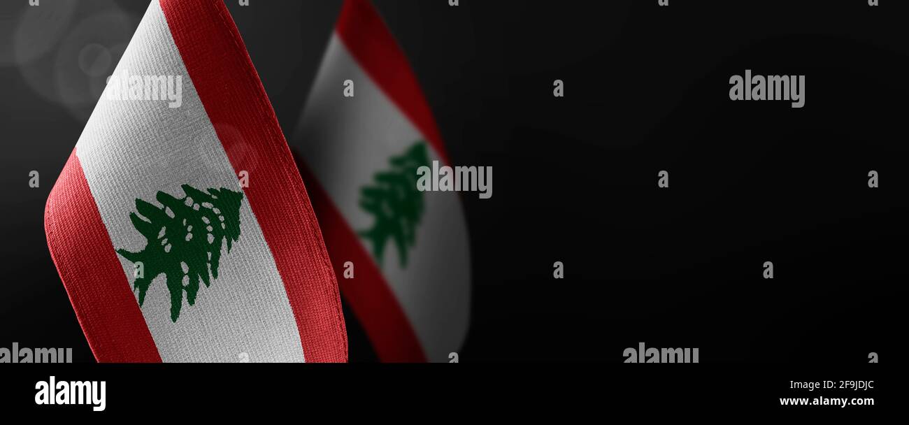 Small national flags of the Lebanon on a dark background Stock Photo ...