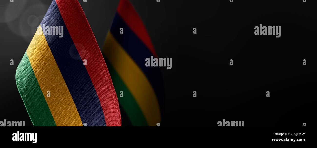 Small national flags of the Mauritius on a dark background Stock Photo ...