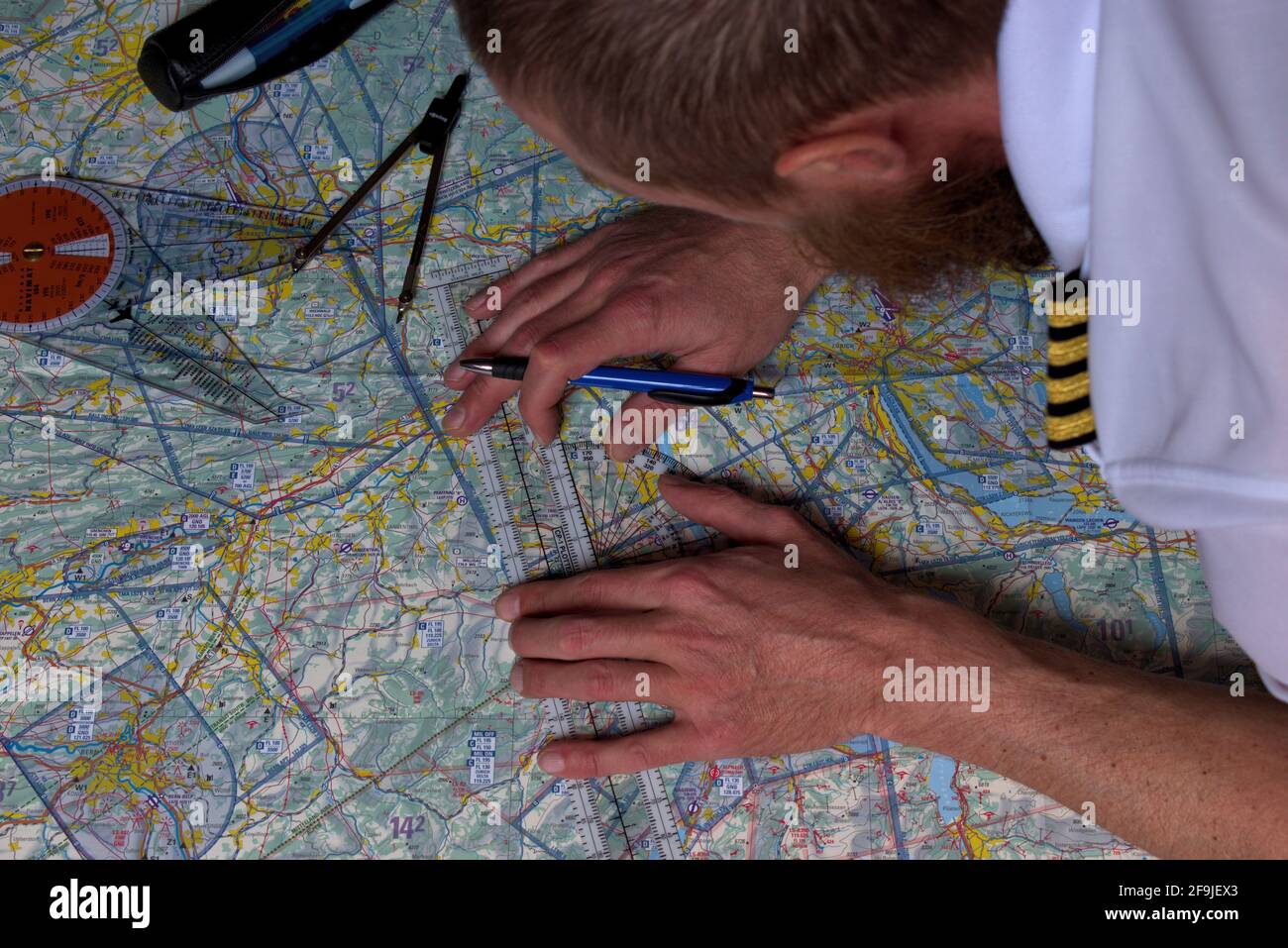 Pilot is calculating his navigation route on an actual map 25.3.2021 ...