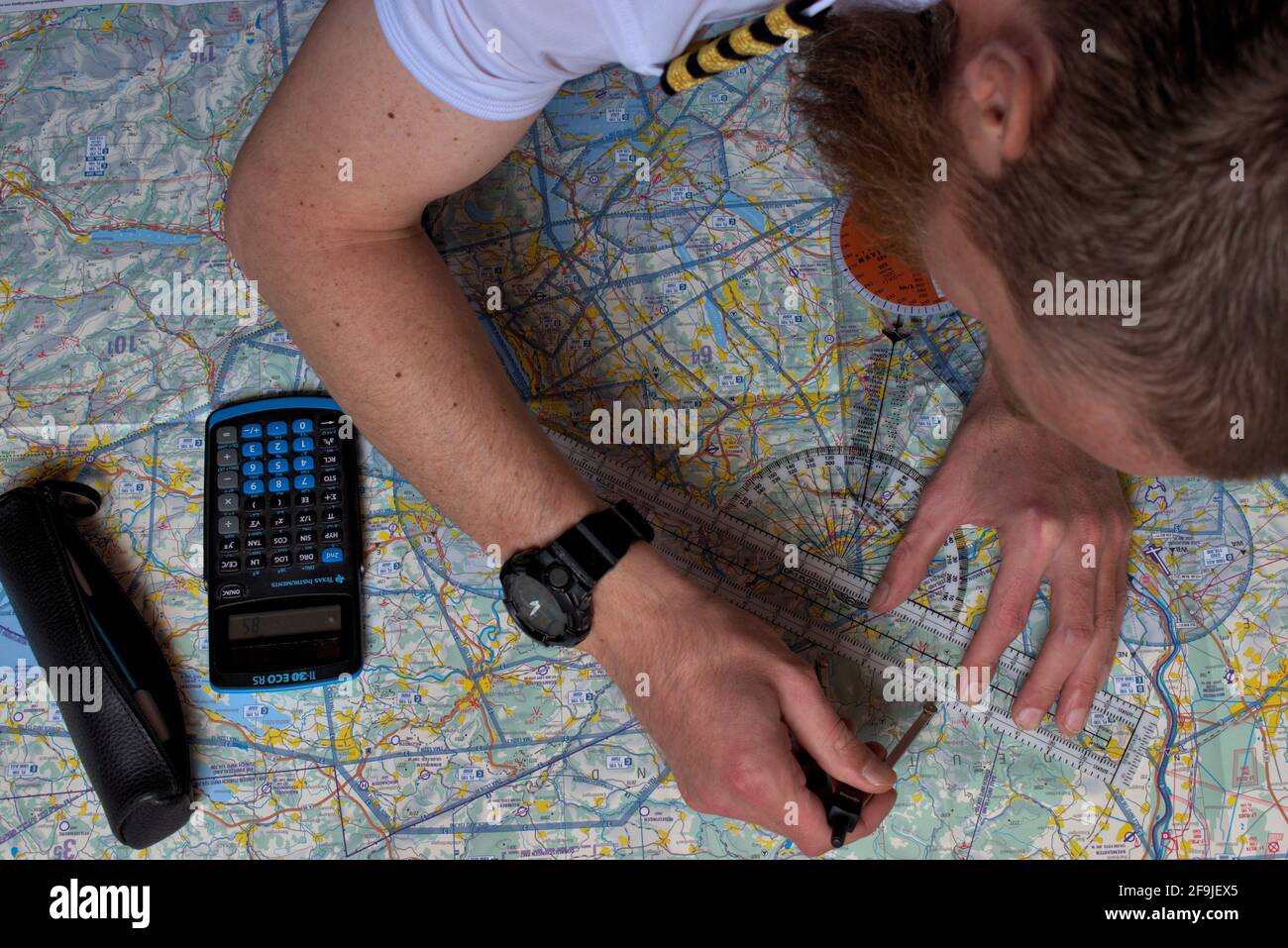 Pilot is calculating his navigation route on an actual map 25.3.2021 ...
