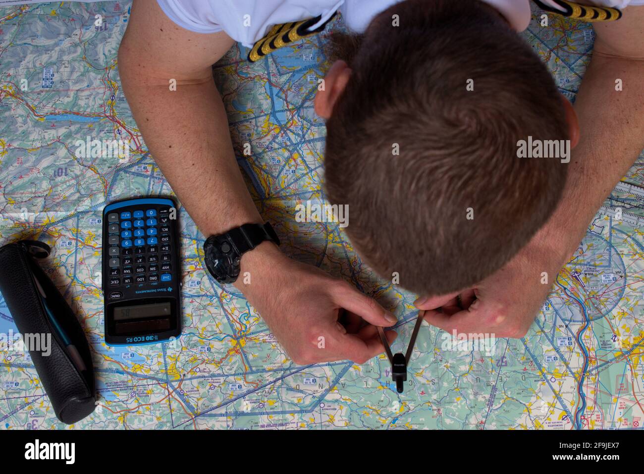 Pilot is calculating his navigation route on an actual map 25.3.2021 ...