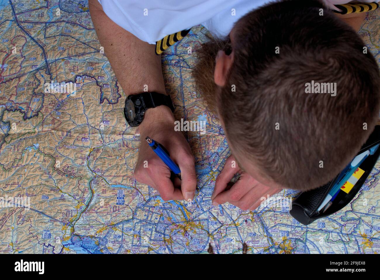 Pilot is calculating his navigation route on an actual map 25.3.2021 ...