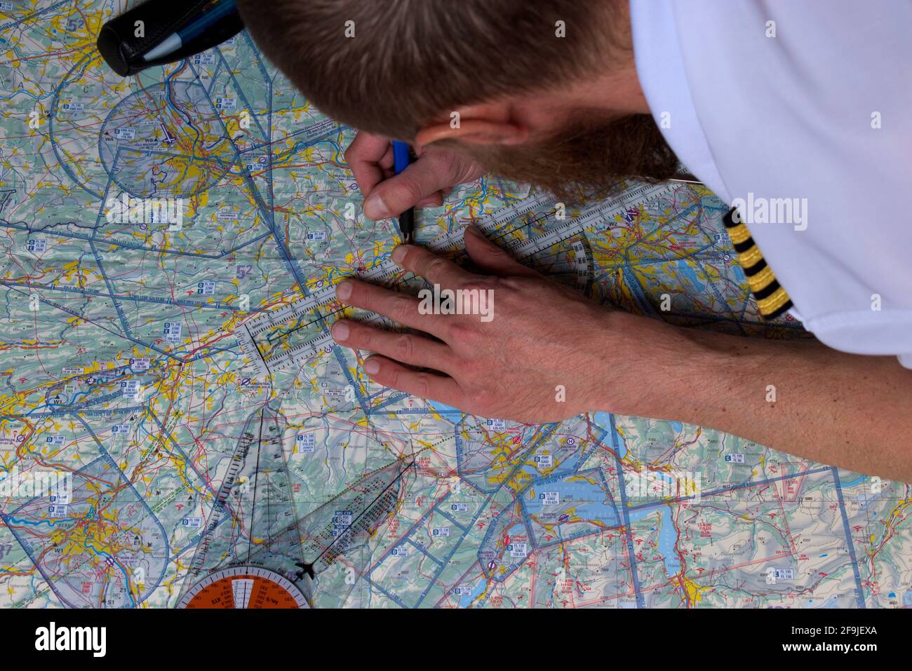 Pilot is calculating his navigation route on an actual map 25.3.2021 ...