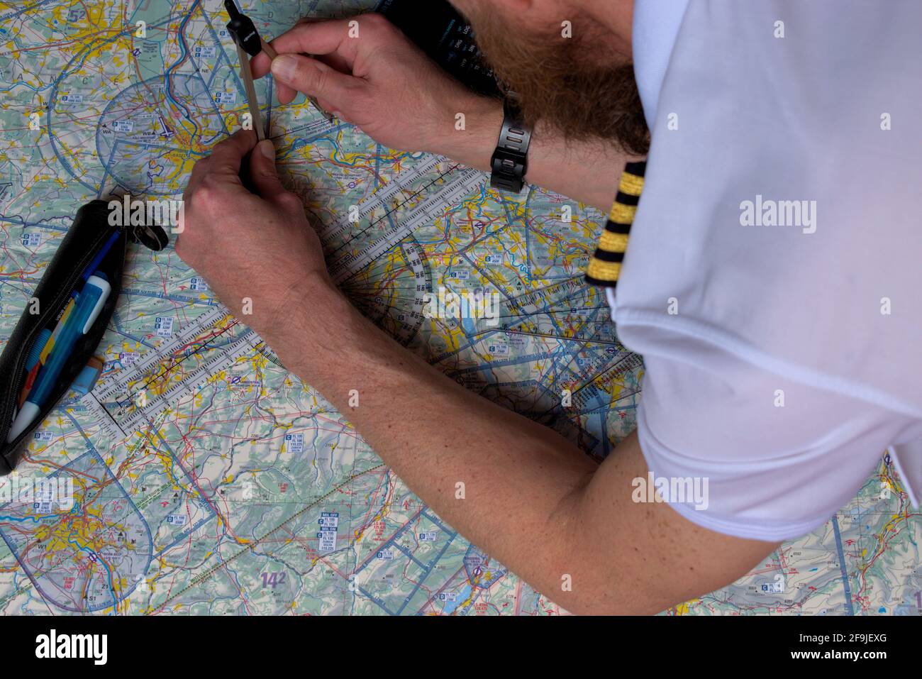 Pilot is calculating his navigation route on an actual map 25.3.2021 ...