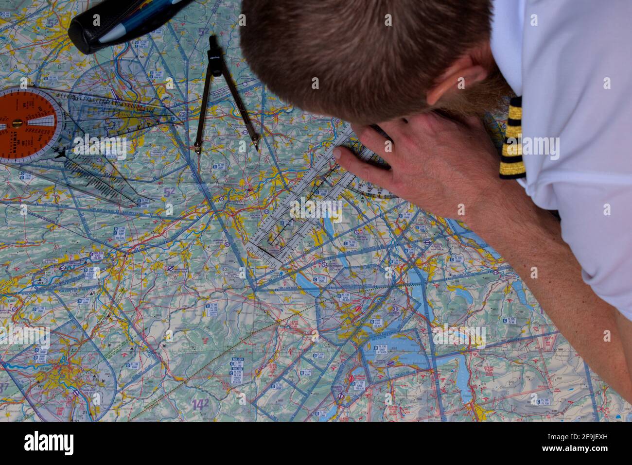 Pilot is calculating his navigation route on an actual map 25.3.2021 ...