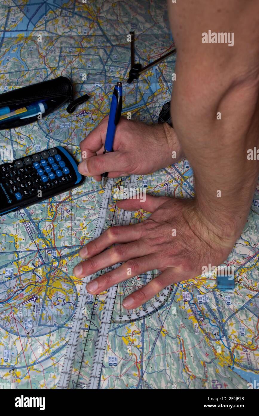 Pilot is calculating his navigation route on an actual map 25.3.2021 ...