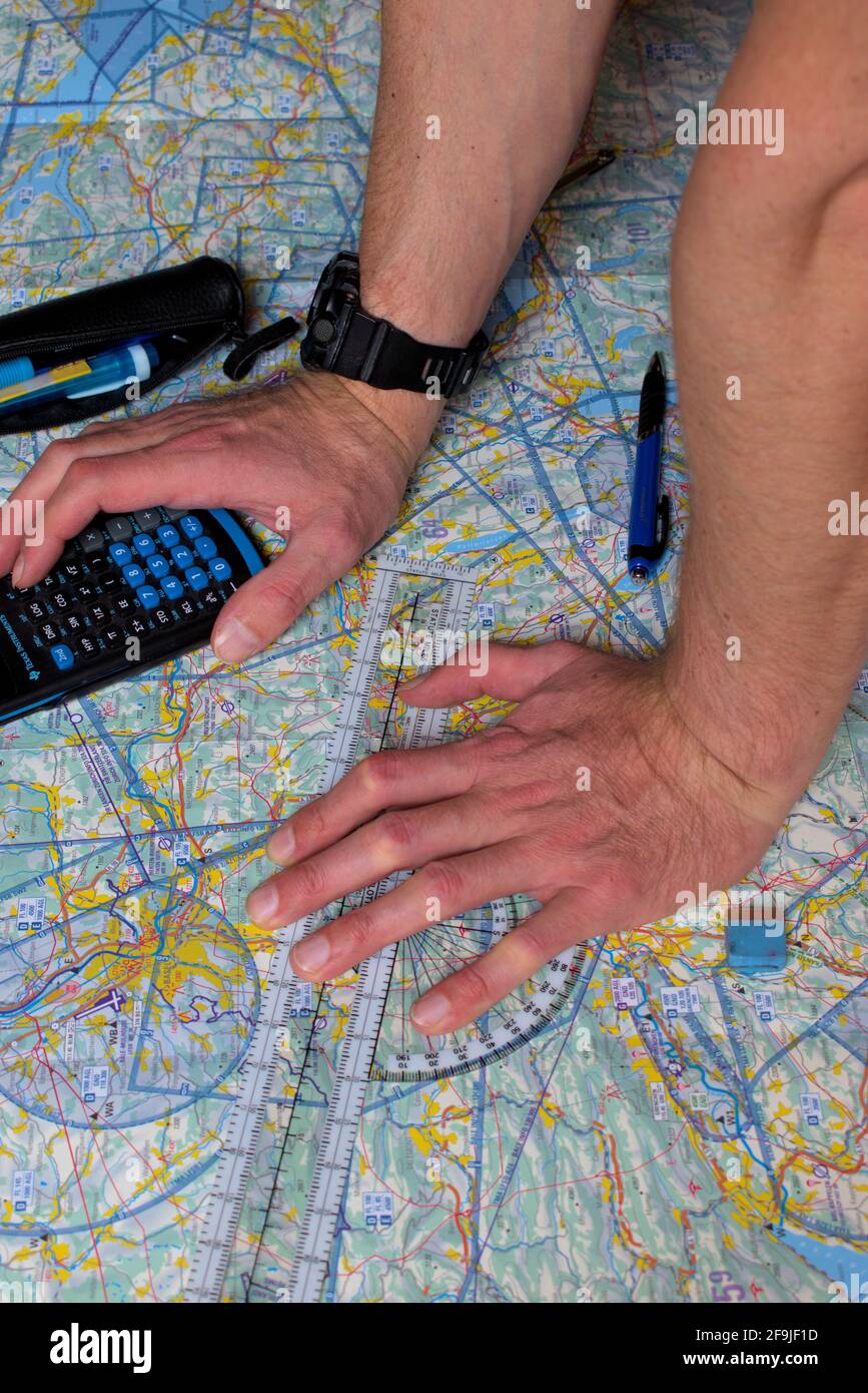 Pilot is calculating his navigation route on an actual map 25.3.2021 ...