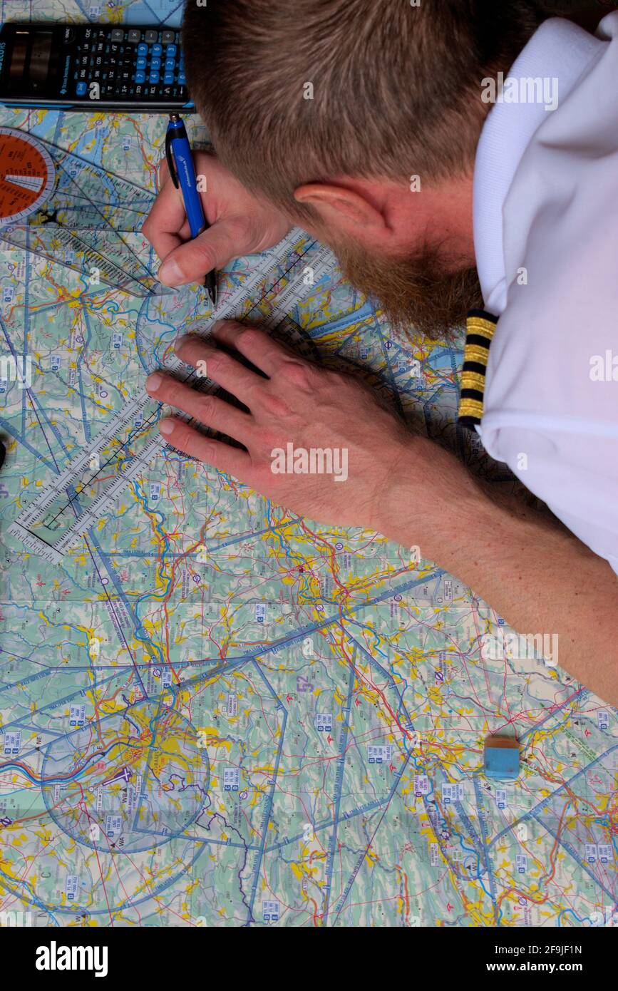Pilot is calculating his navigation route on an actual map 25.3.2021 ...