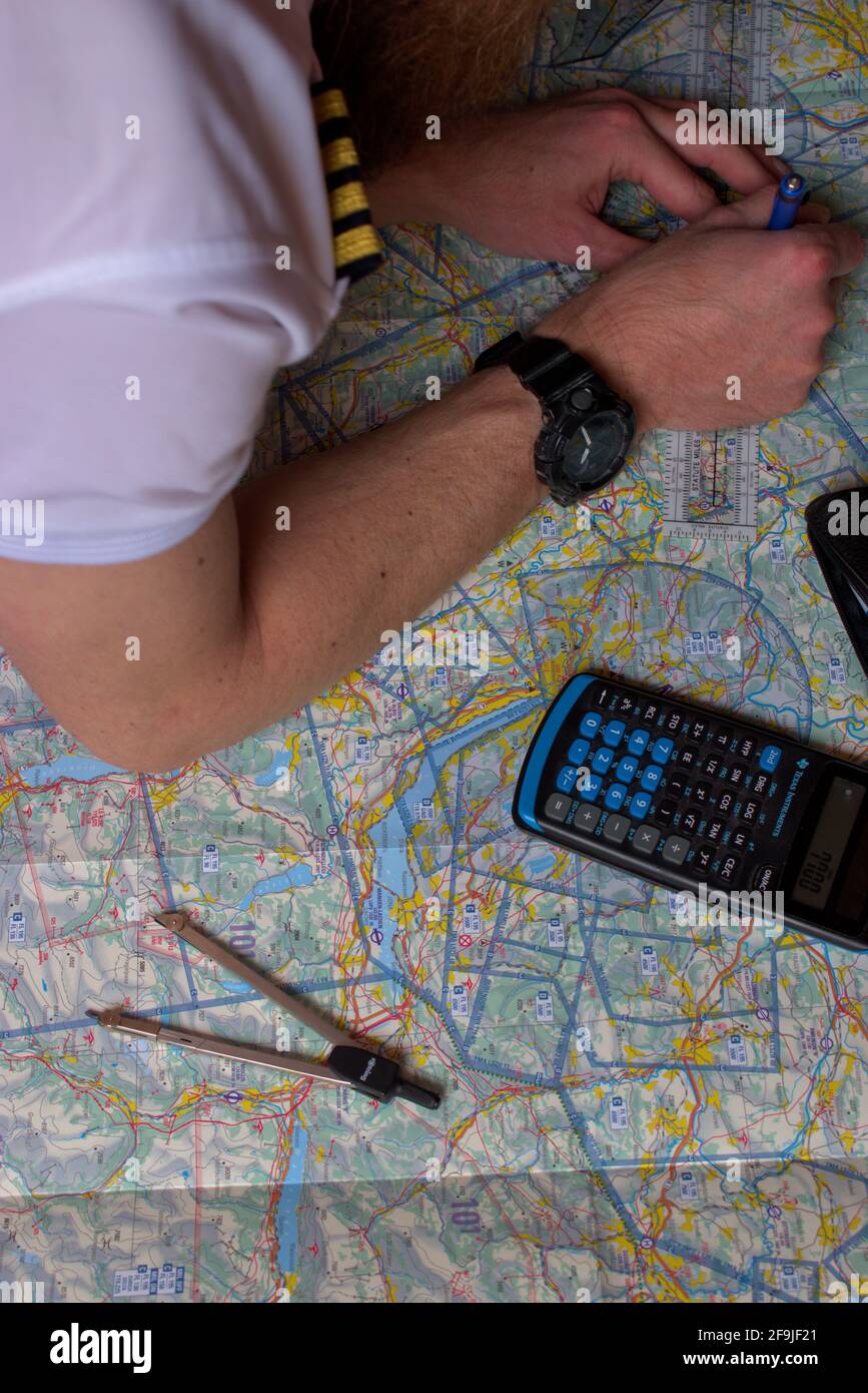 Pilot is calculating his navigation route on an actual map 25.3.2021 ...
