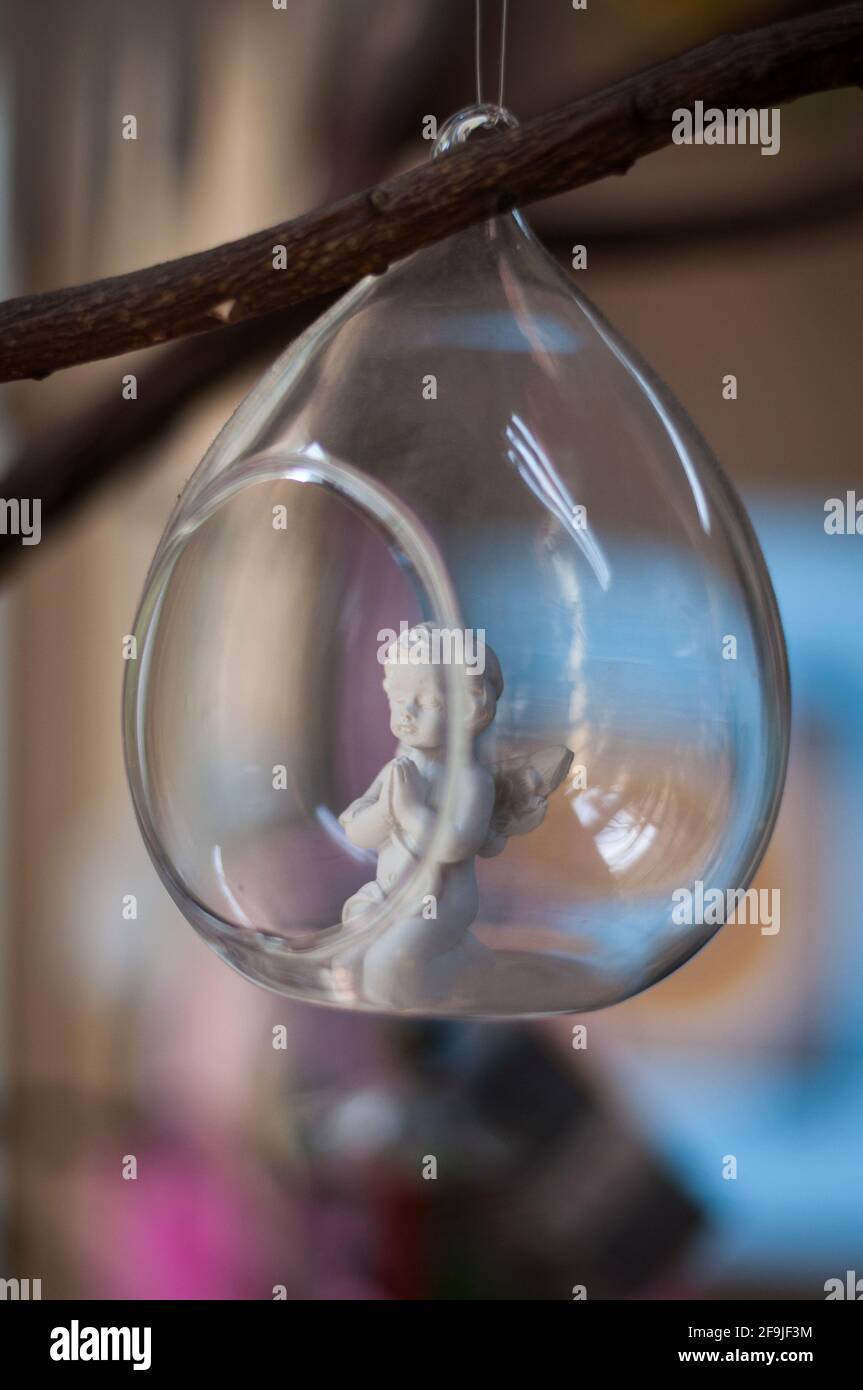 glass ball with a little angel inside Stock Photo - Alamy