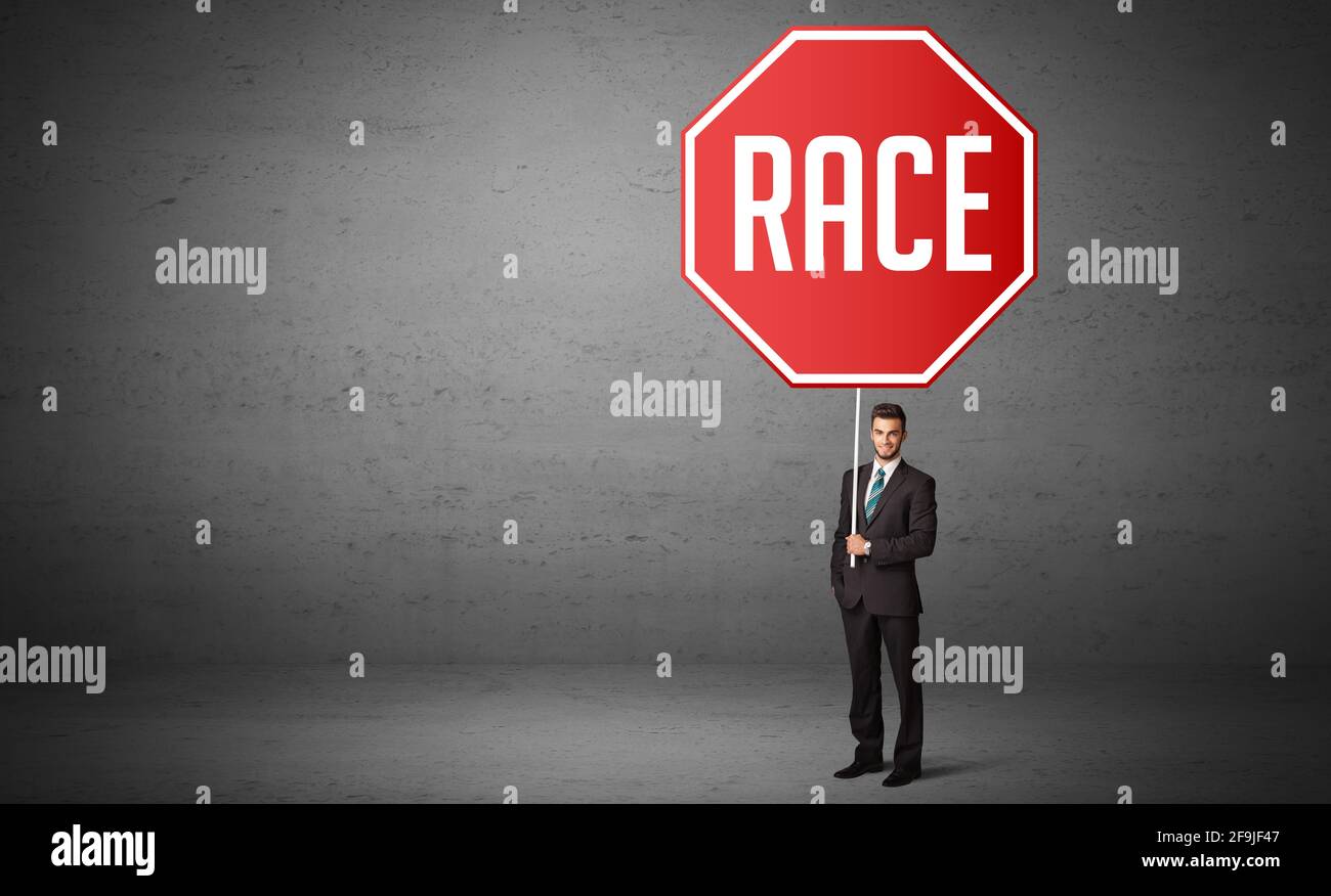Young business person holding road sign Stock Photo - Alamy