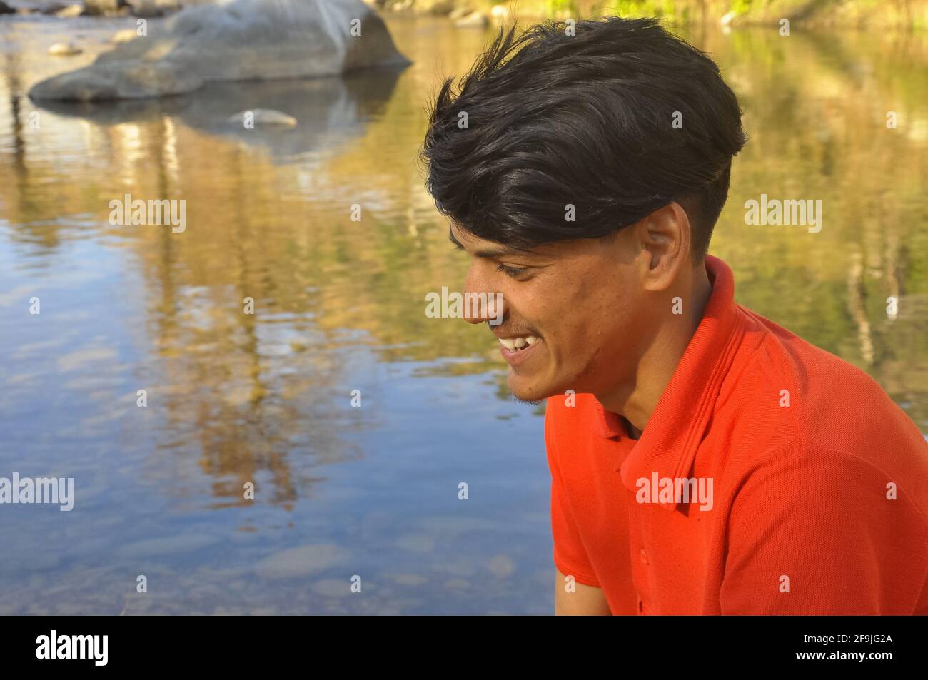 Positive young asian guy in hi-res stock photography and images - Alamy