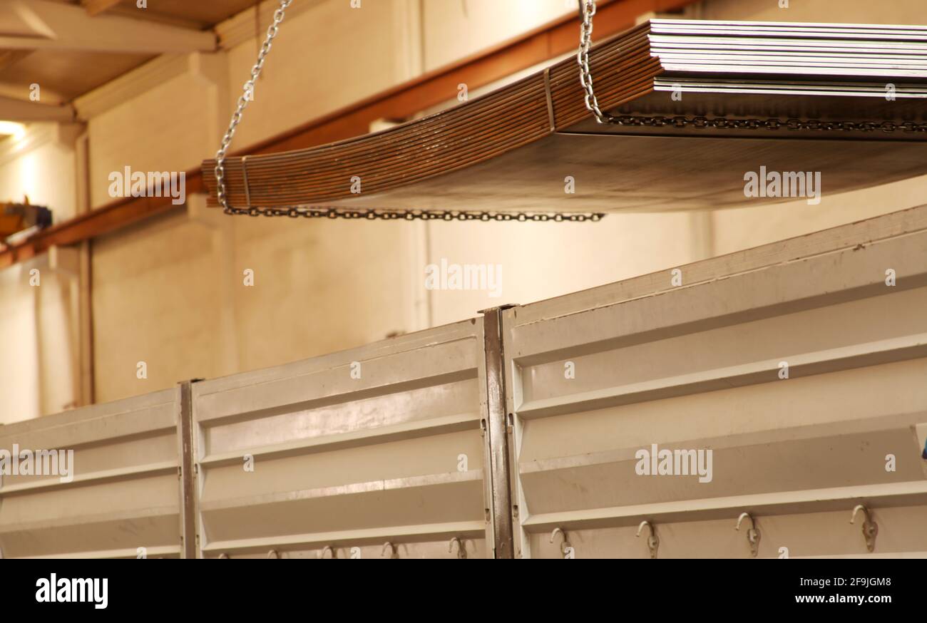 New metal sheets. Loading goods on the truck Stock Photo - Alamy