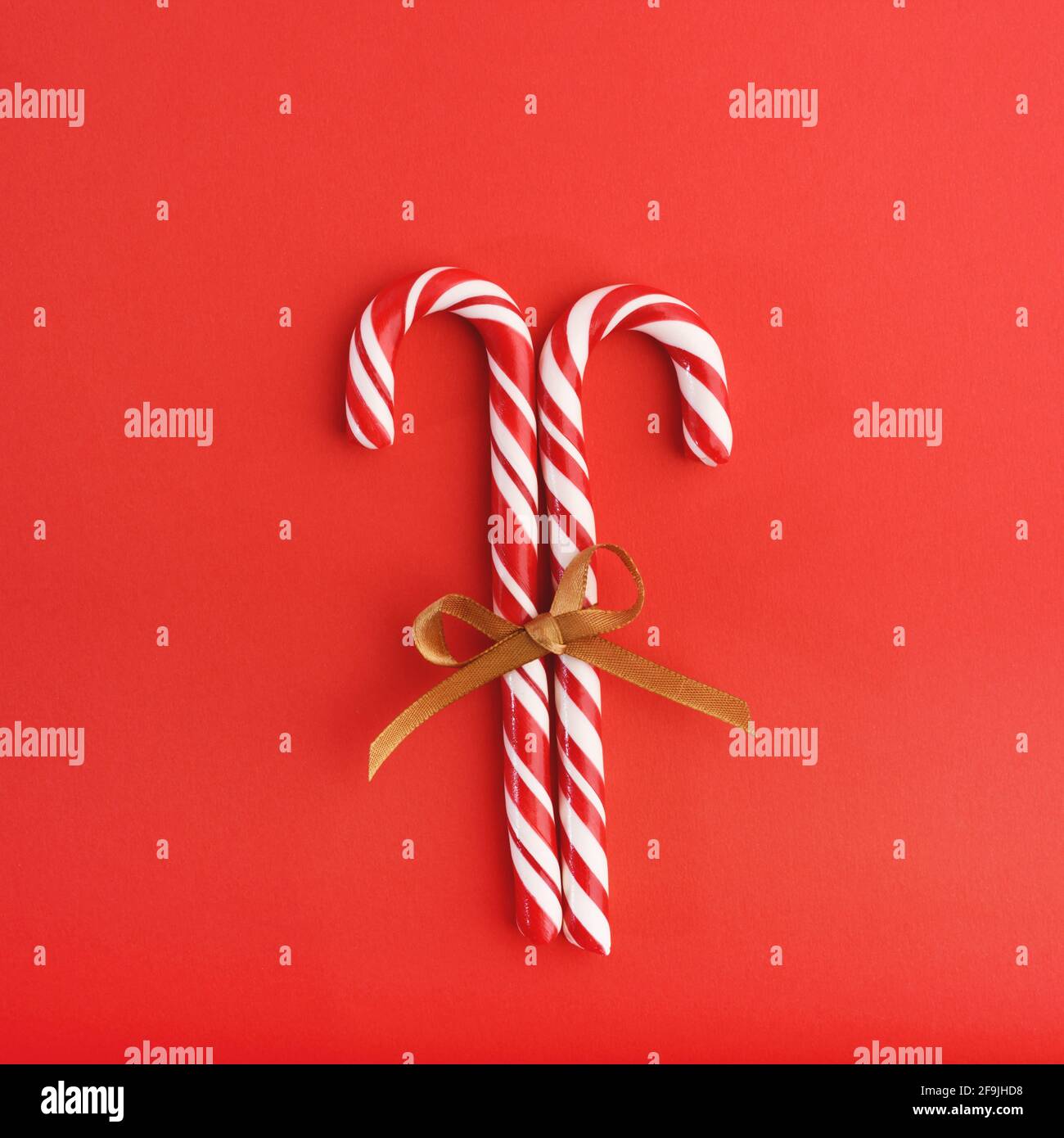 Christmas striped red and white hard candies connected with the ribbon ...