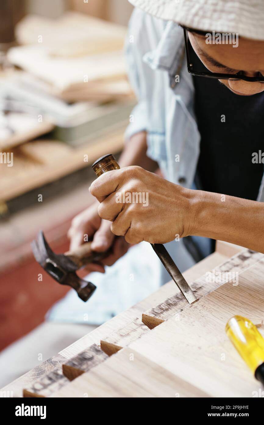 Male using wood chisel hi-res stock photography and images - Alamy